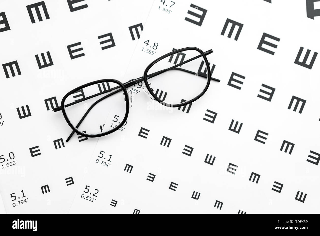 Black glasses and visual meter on white background Stock Photo - Alamy