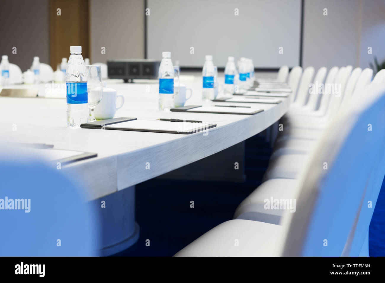 white big table in modern meeting room Stock Photo - Alamy