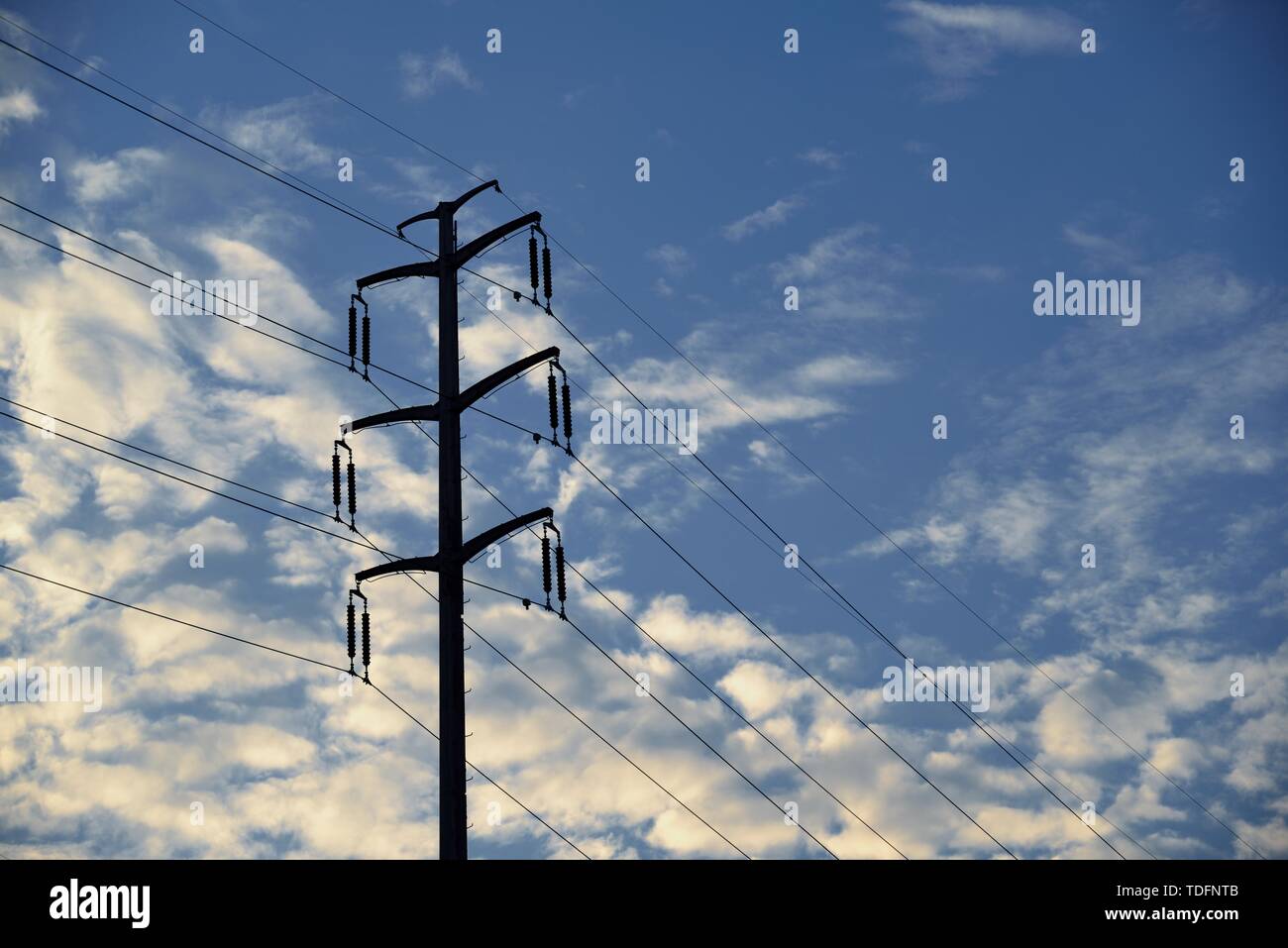 Blue sky, white clouds and telephone poles Stock Photo - Alamy