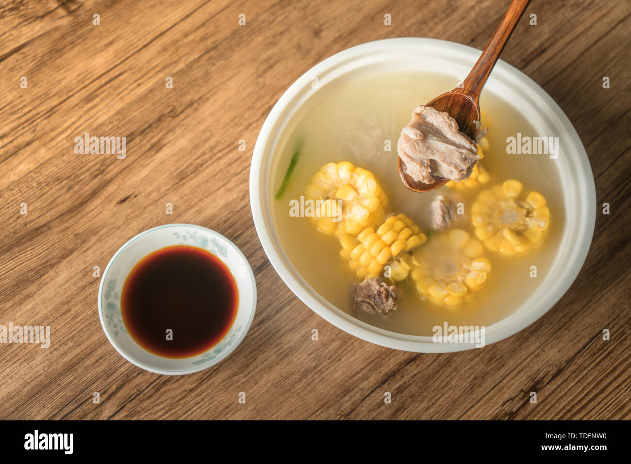 Corn bone broth with wood pattern background Stock Photo - Alamy