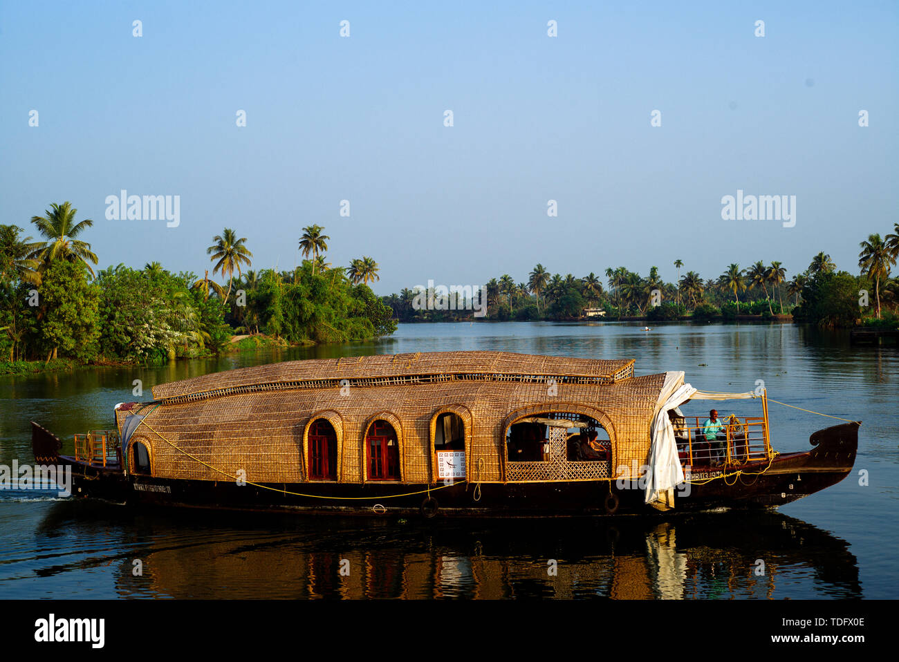 Traditional Indian Houseboats cruise down the Kerala backwater near ...