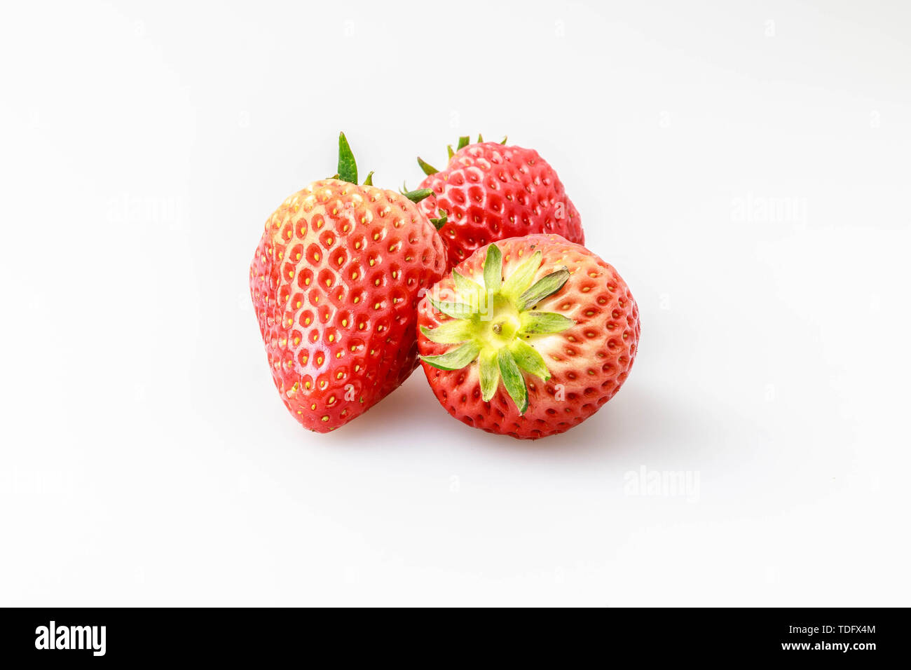 Three fresh strawberries Stock Photo - Alamy