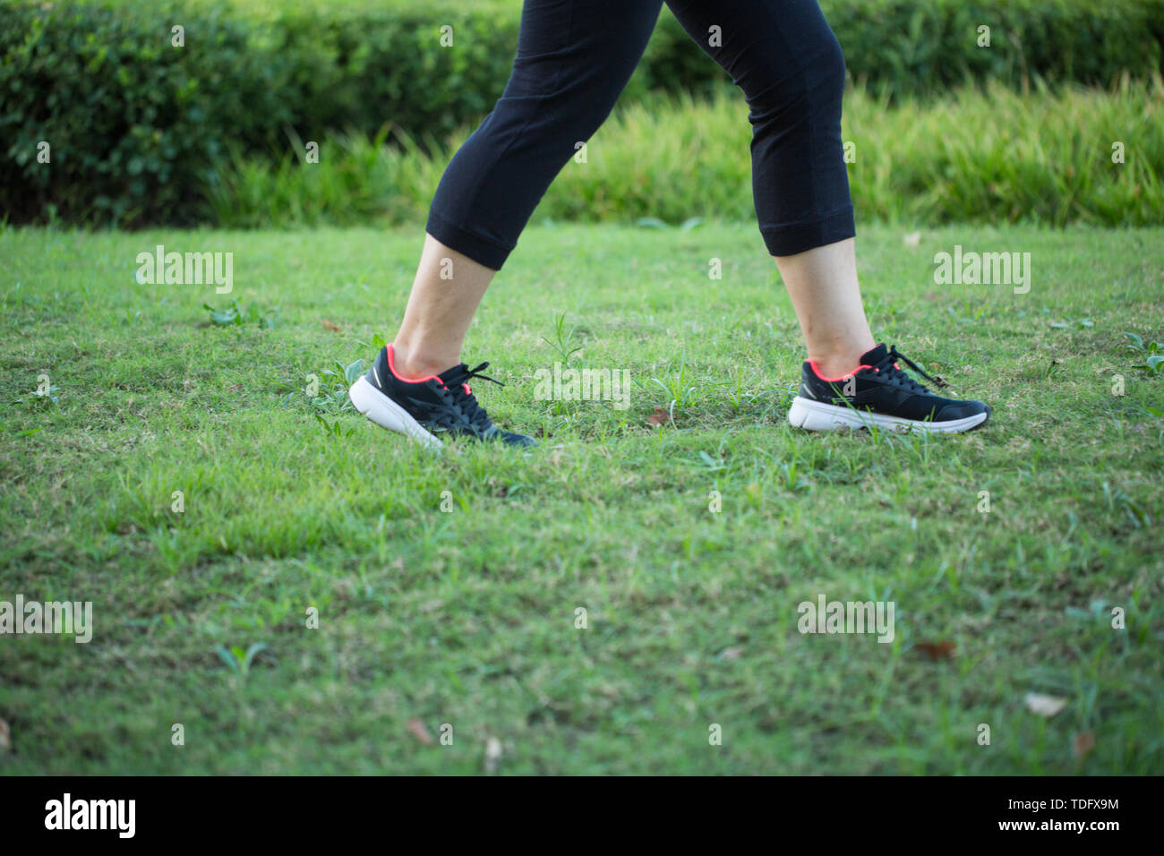 Man running on grass Stock Photo - Alamy