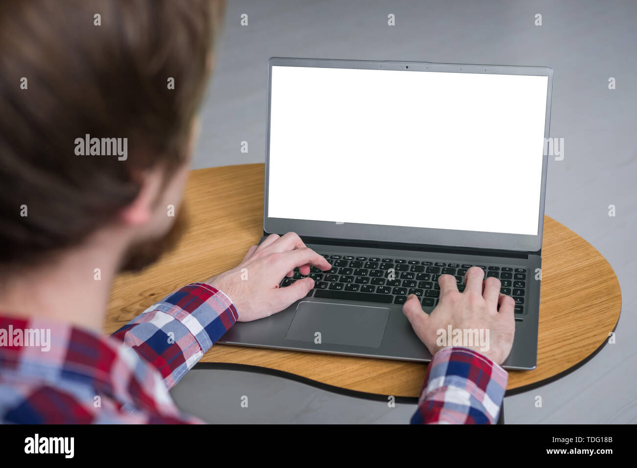 Over shoulder view: man freelancer typing on laptop computer keyboard ...