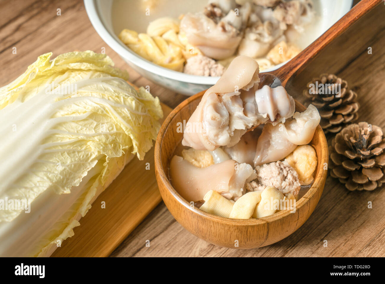 Pig's hoof soup, soup with nutrition with wood grain background Stock ...