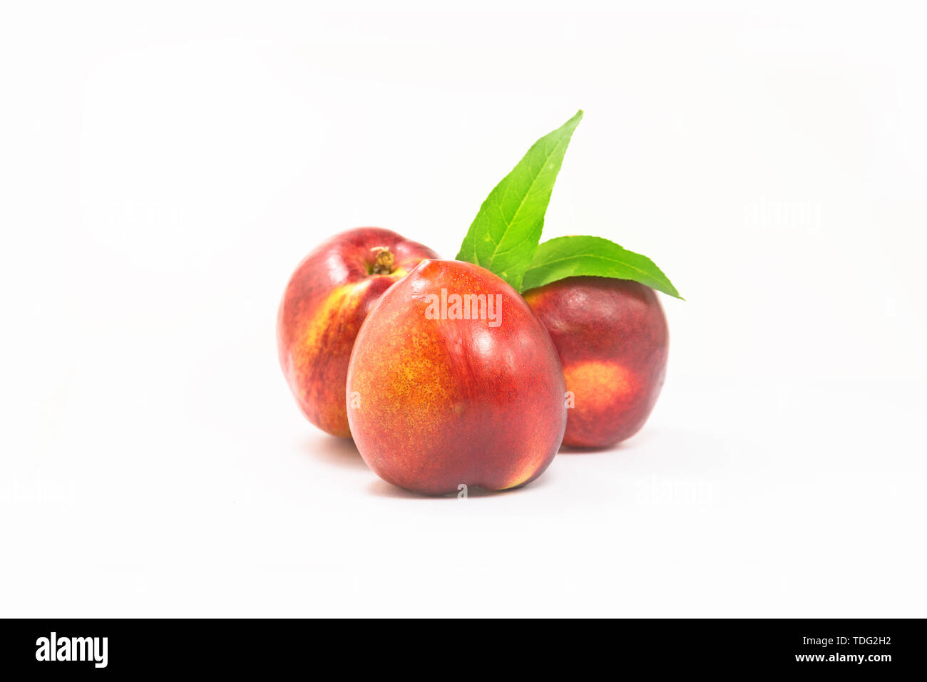 nectarines on white background Stock Photo - Alamy