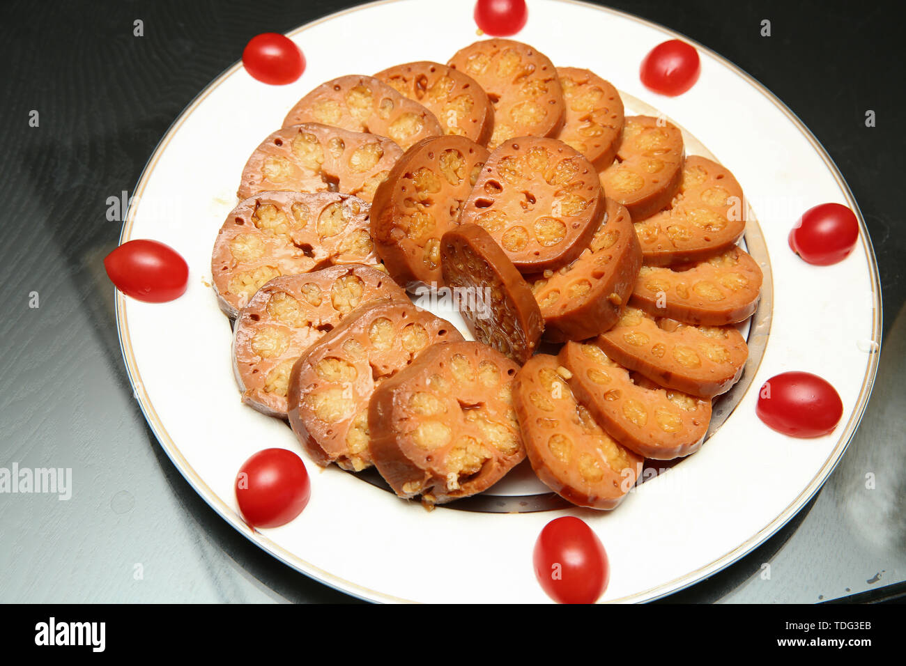Sweet and sour lotus root slices Stock Photo - Alamy