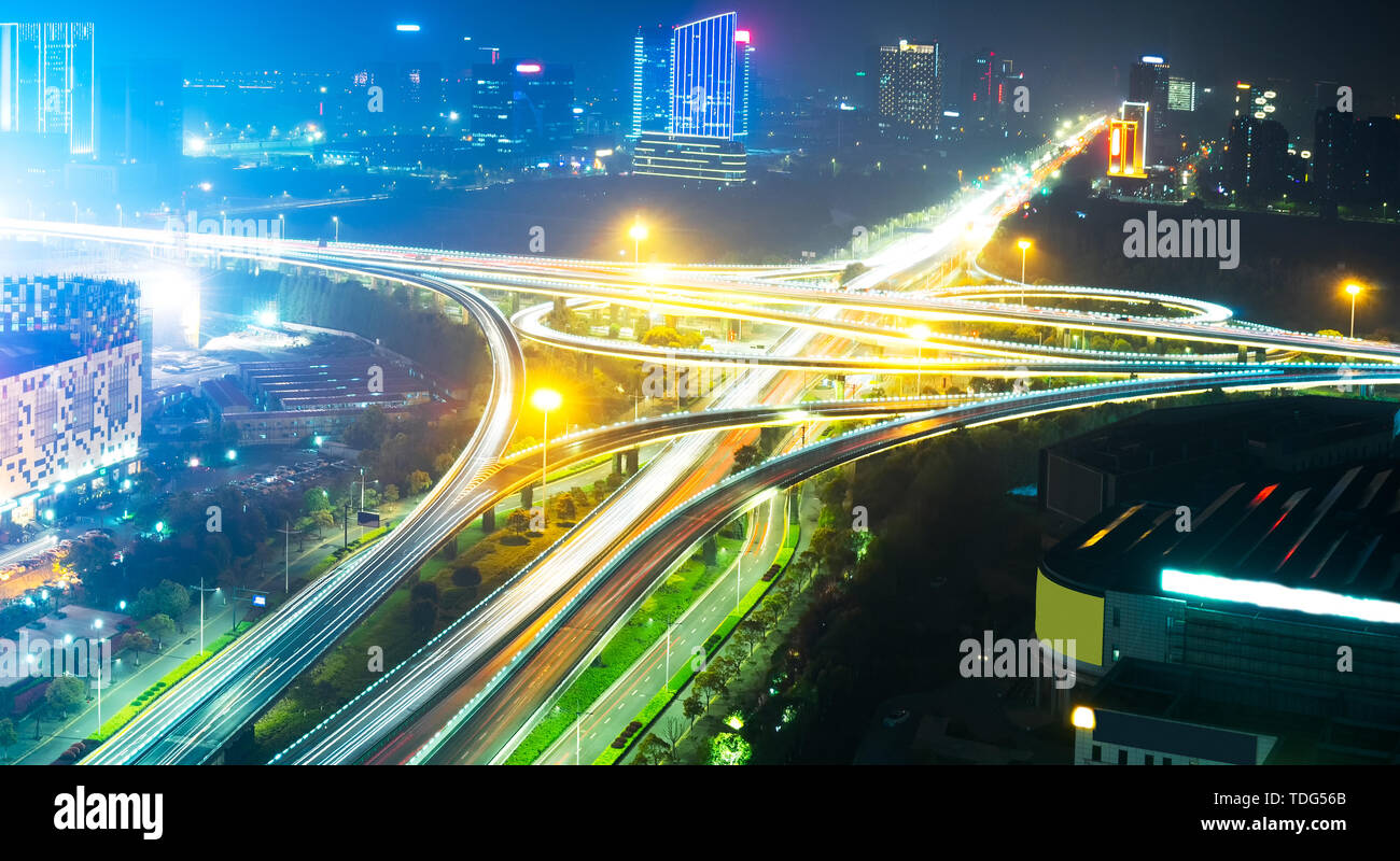 busy road junction in modern city at night Stock Photo - Alamy