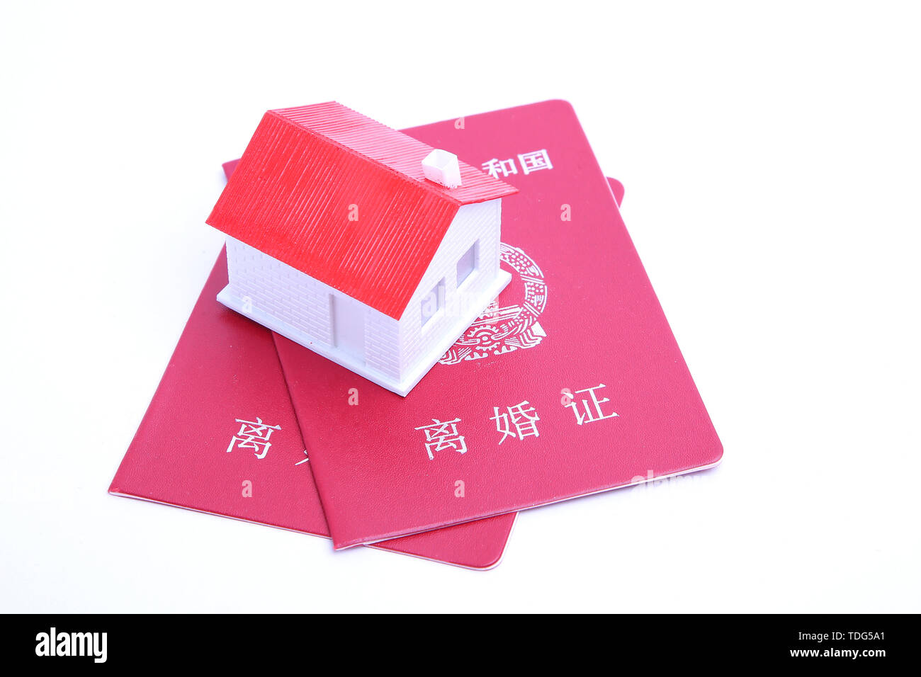 Divorce certificates and house models Stock Photo - Alamy