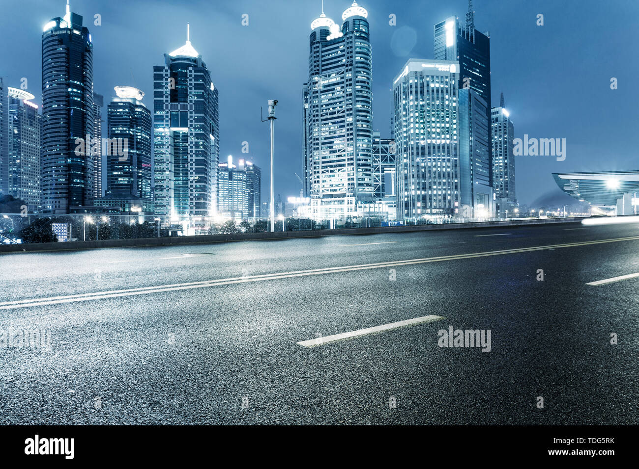 urban road,illuminated skyline background Stock Photo - Alamy