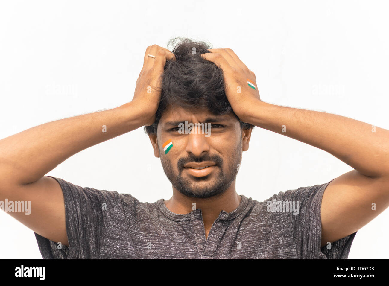 Portrait of curious or tense Young Indian male Cricket sports fan ...