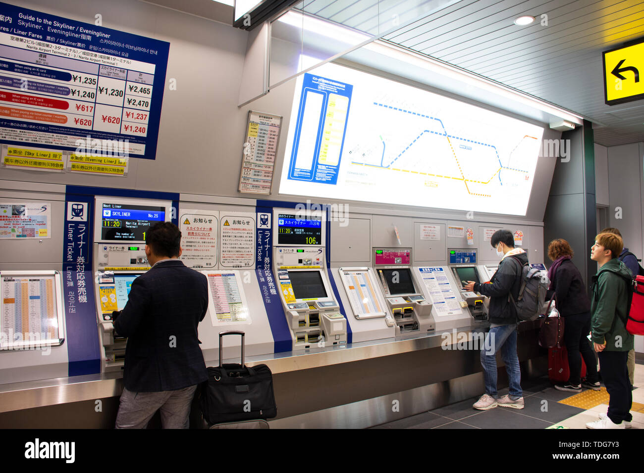 Japanese people and foreign travelers passenger wait and stand in queue ...