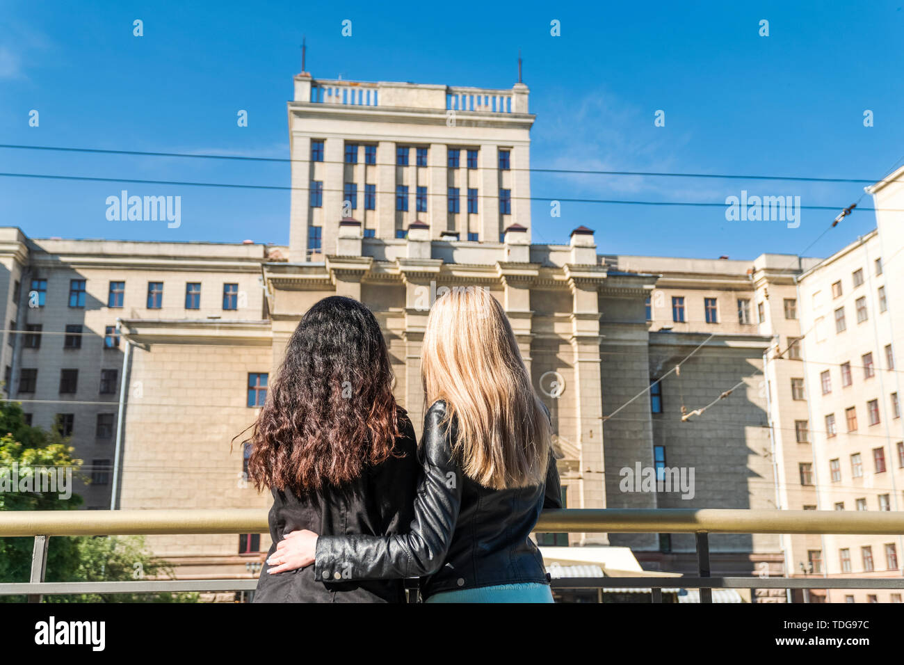 Two women hugging, rear view hi-res stock photography and images - Alamy