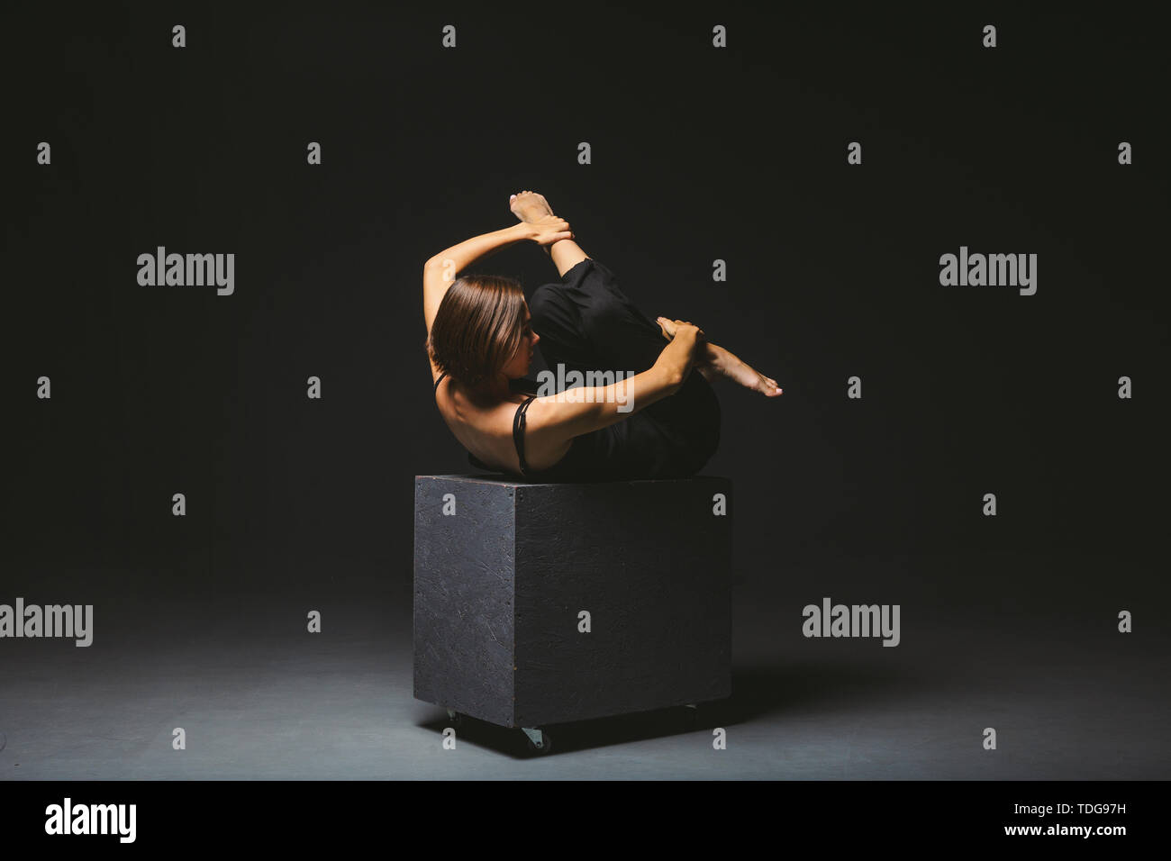 Social theme. young Caucasian woman in strange pose in dress posing on ...