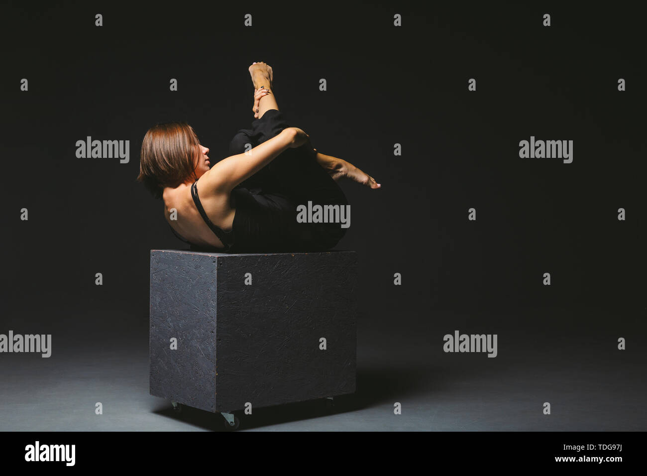 Social theme. young Caucasian woman in strange pose in dress posing on ...