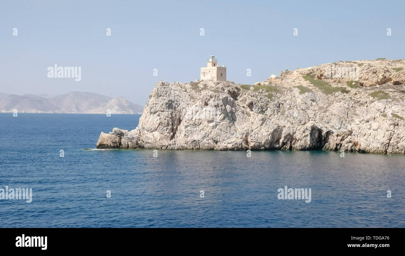 a lighthouse in ormos harbor on the island of ios, greece Stock Photo ...