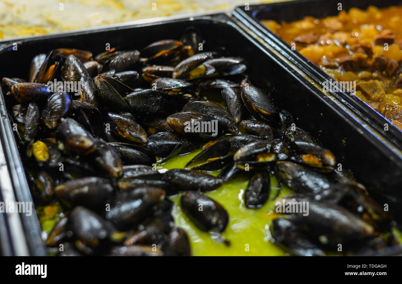 Clam with hot sauce at buffet restaurant. Food concept Stock Photo - Alamy
