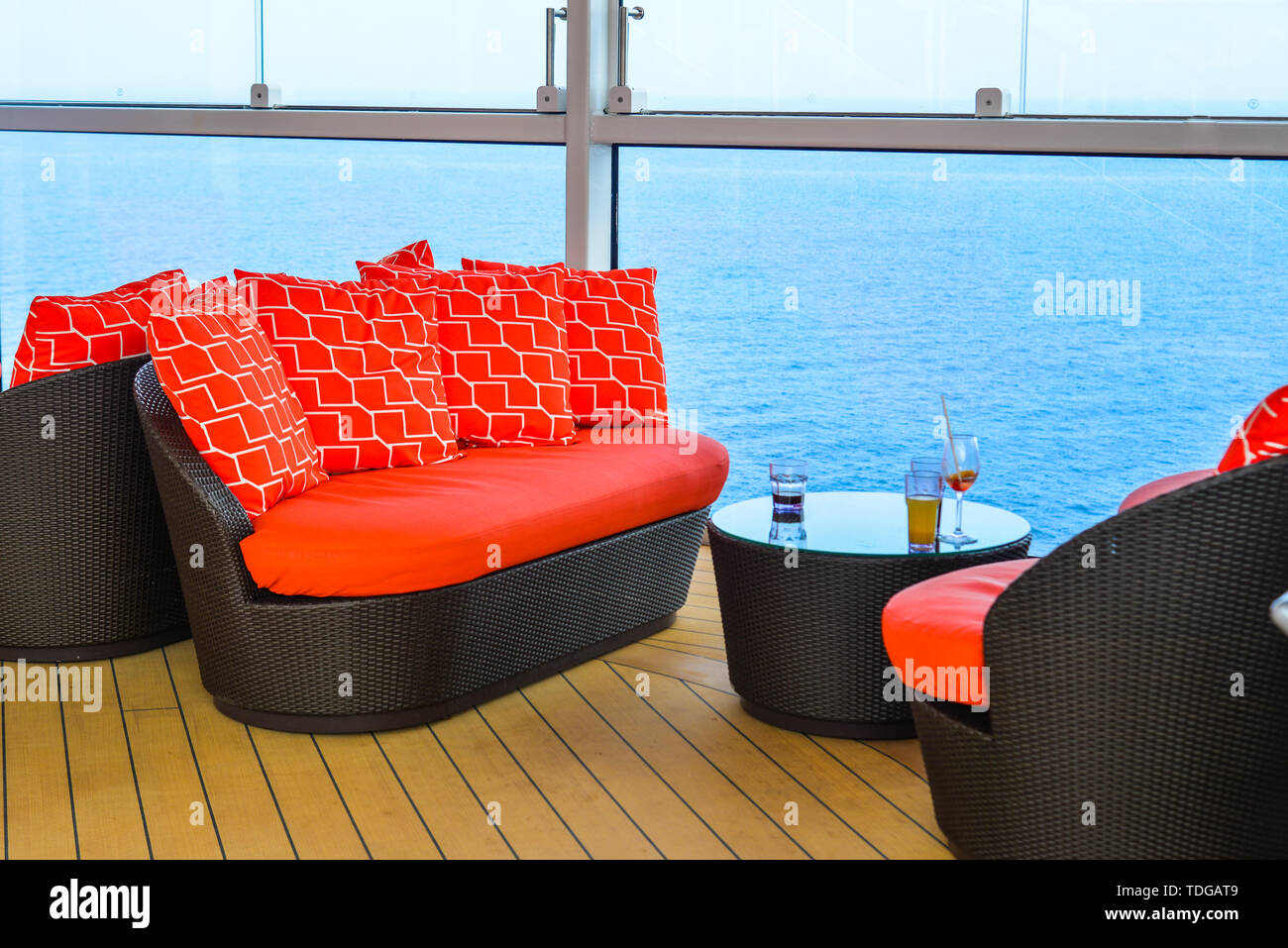 Empty sunbed lounge chairs for relaxing on the open deck of a cruise ...