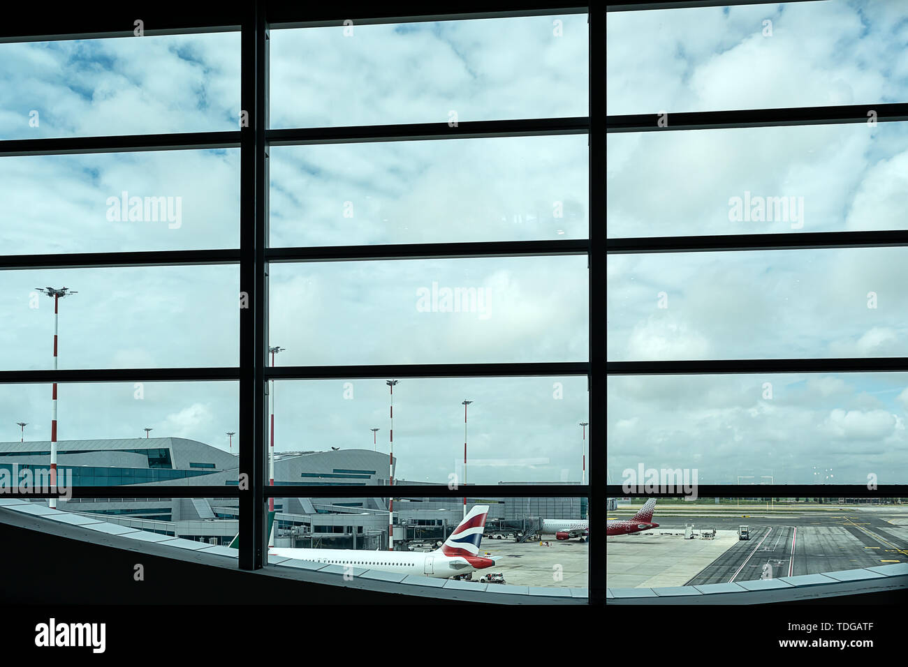 Looking to the airport through the terminal window Stock Photo - Alamy