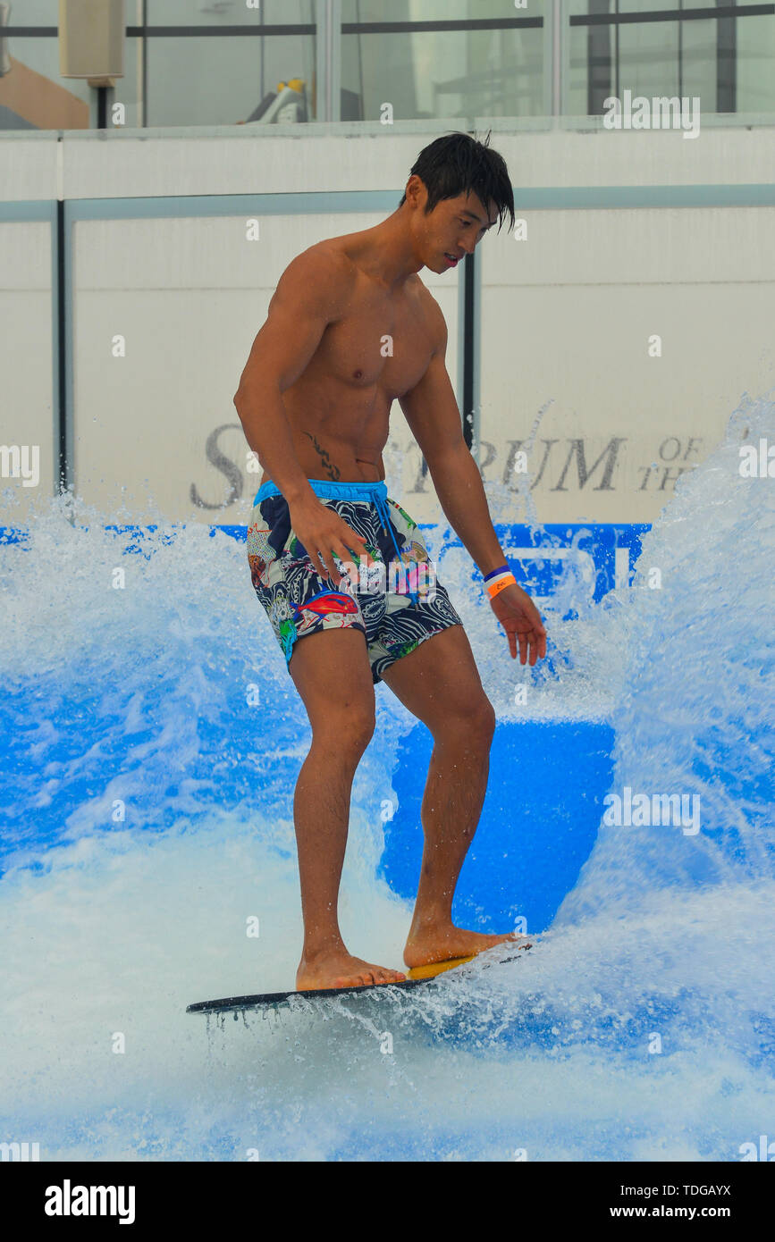 Shanghai, China - Jun 4, 2019. A Chinese man surfing on the Flow Rider ...
