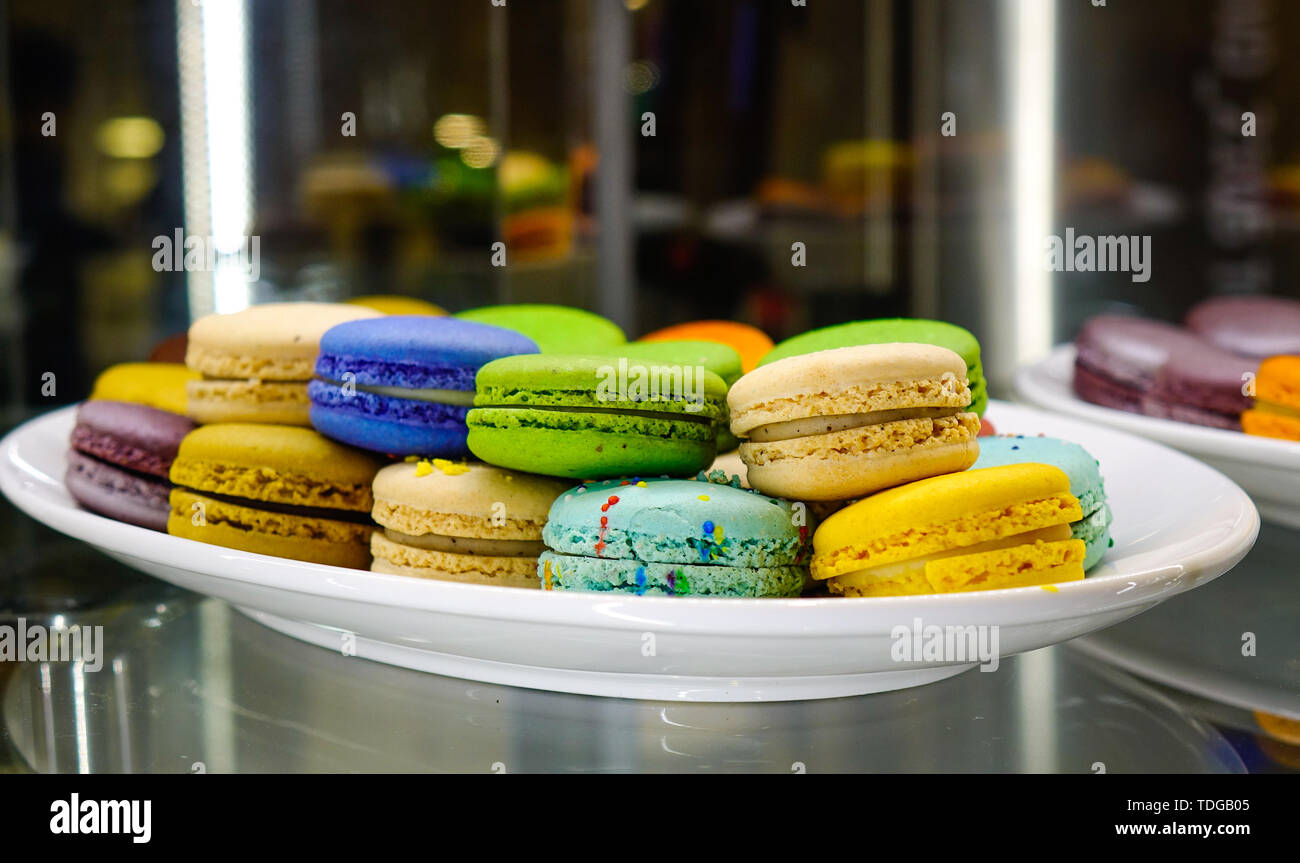 Sweet table (colorful macaron) at luxury buffet restaurant. Food ...