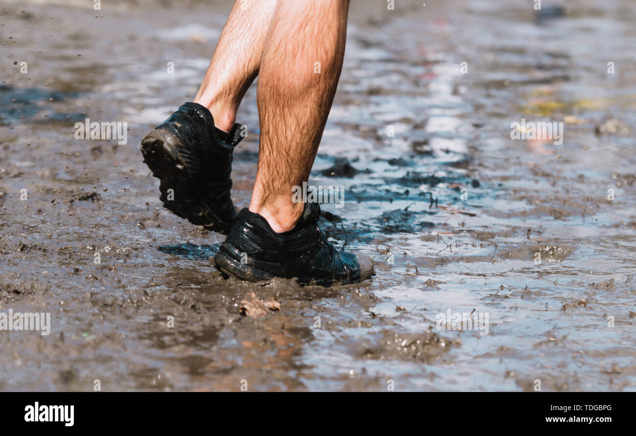 training on bad weather. Running in rain, close up on shoes Stock Photo ...