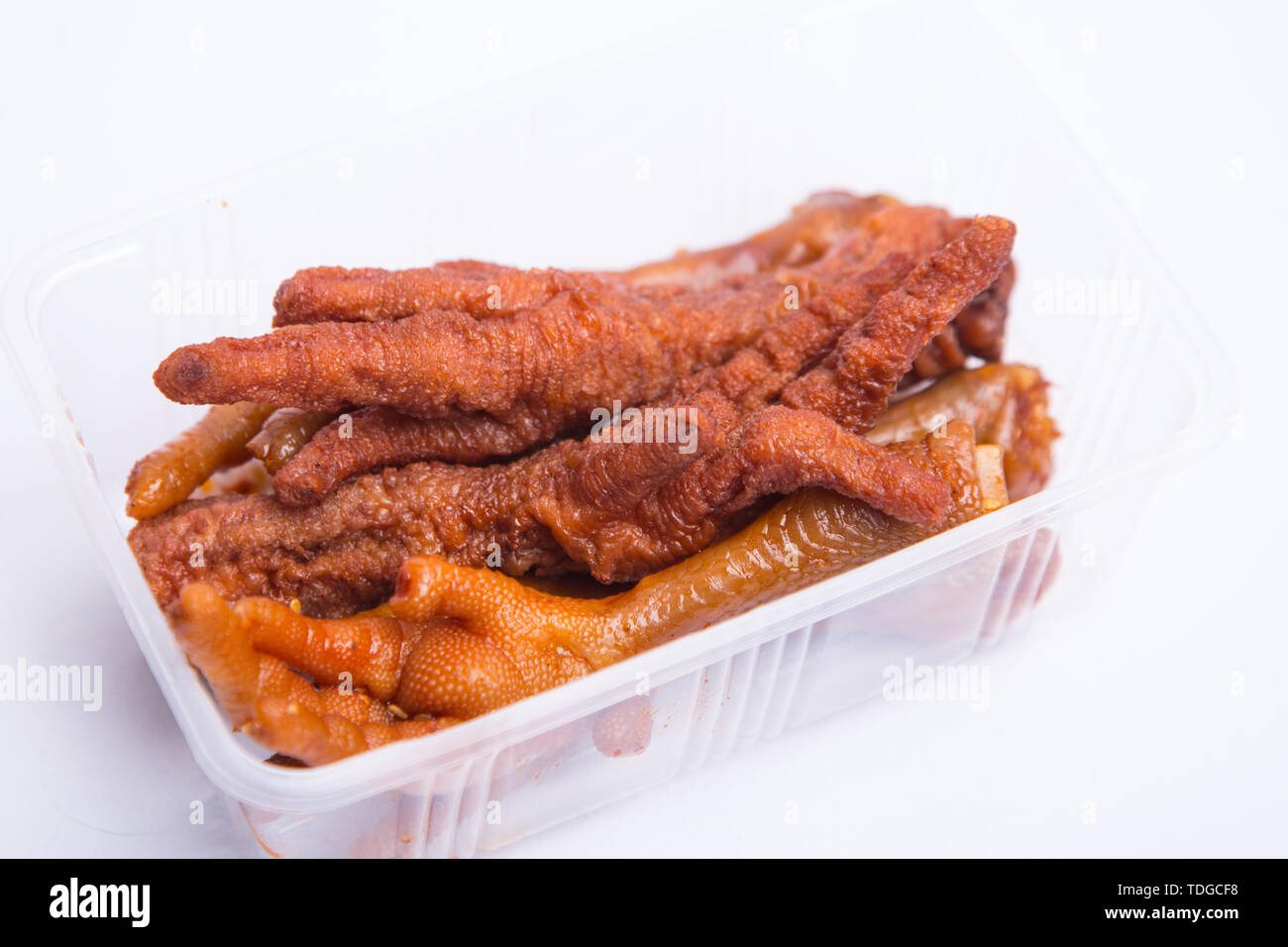 halogen chicken claws Stock Photo - Alamy