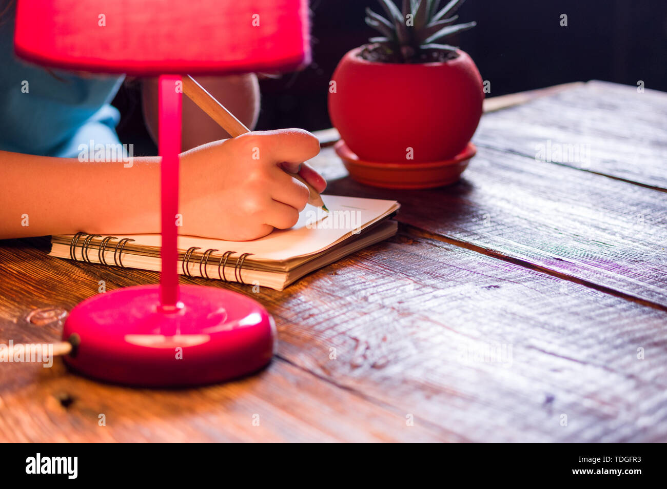 Write a letter. Secret note. Write in pencil in a notebook. Evening ...