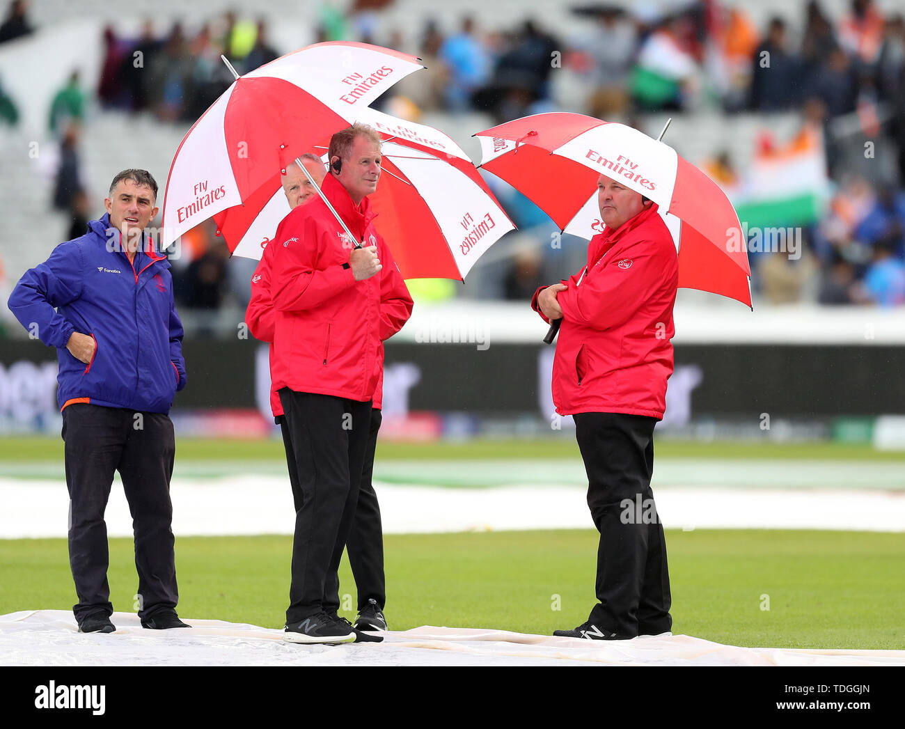 Match umpires Paul Reiffel (left) and Marais Erasmus inspect the field ...