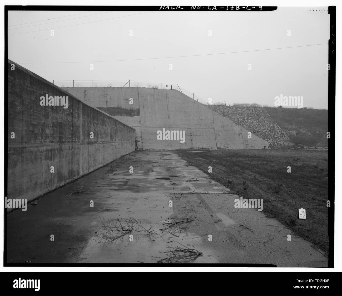 NORTHWEST END OF OGEE WALL; VIEW TO NORTHWEST FROM GRASSED AREA ...