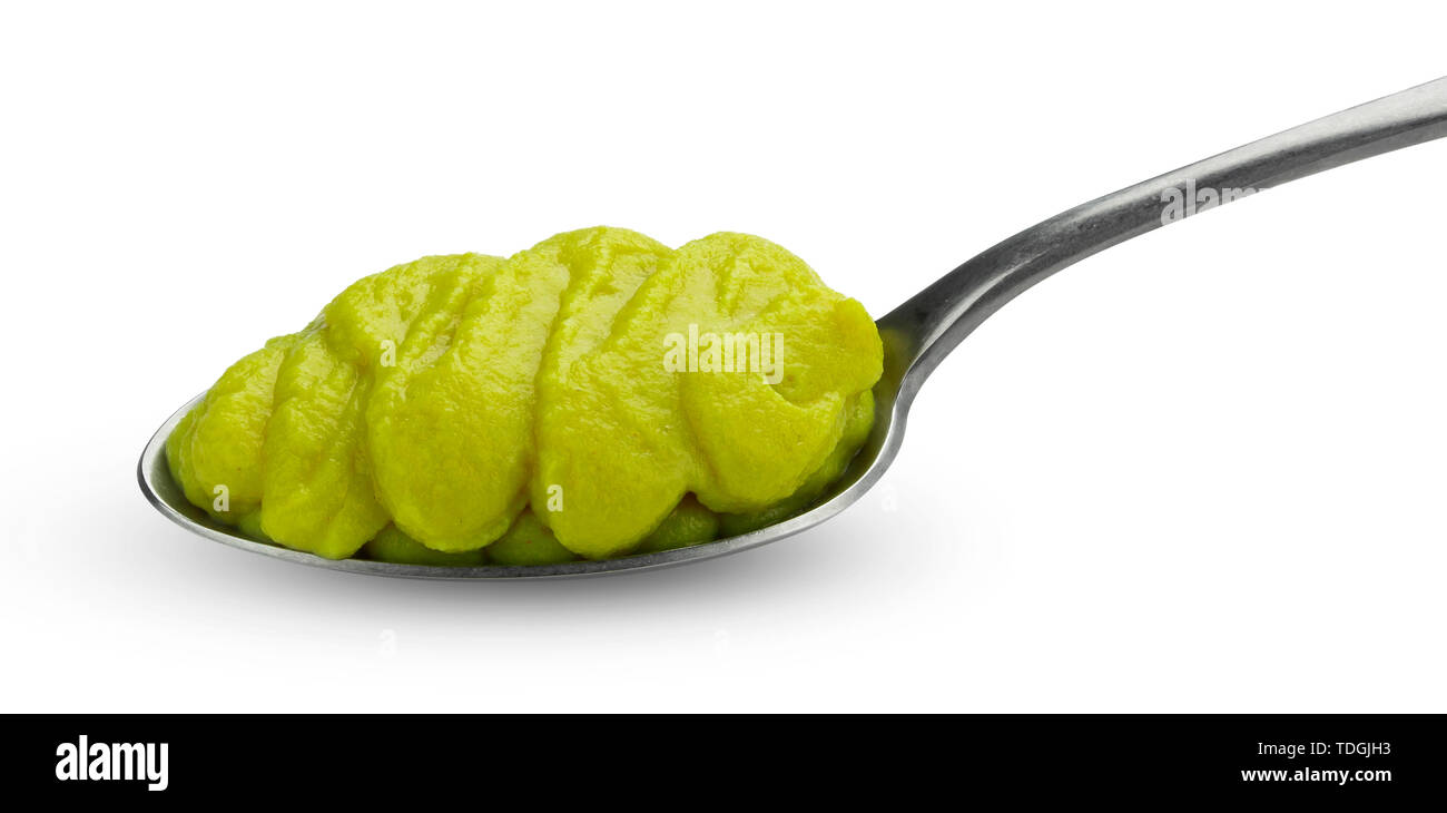 Green vegetable puree for baby food in spoon isolated on white ...