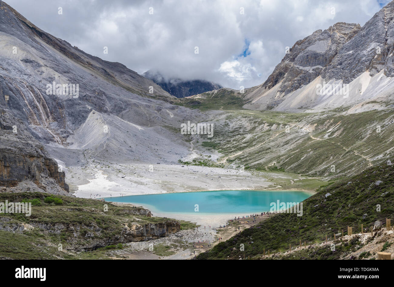 Looking at the sea of milk: thick clouds leaking a seam, the light ...