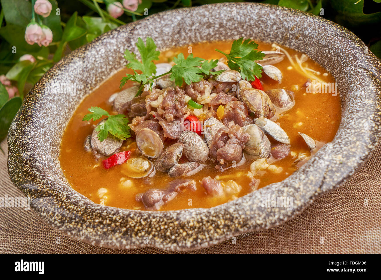 Fat cow clam golden needle mushroom chowder Stock Photo - Alamy
