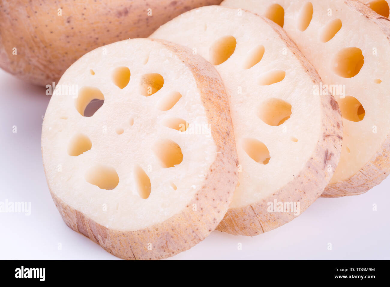 Fresh lotus root on white background Stock Photo - Alamy