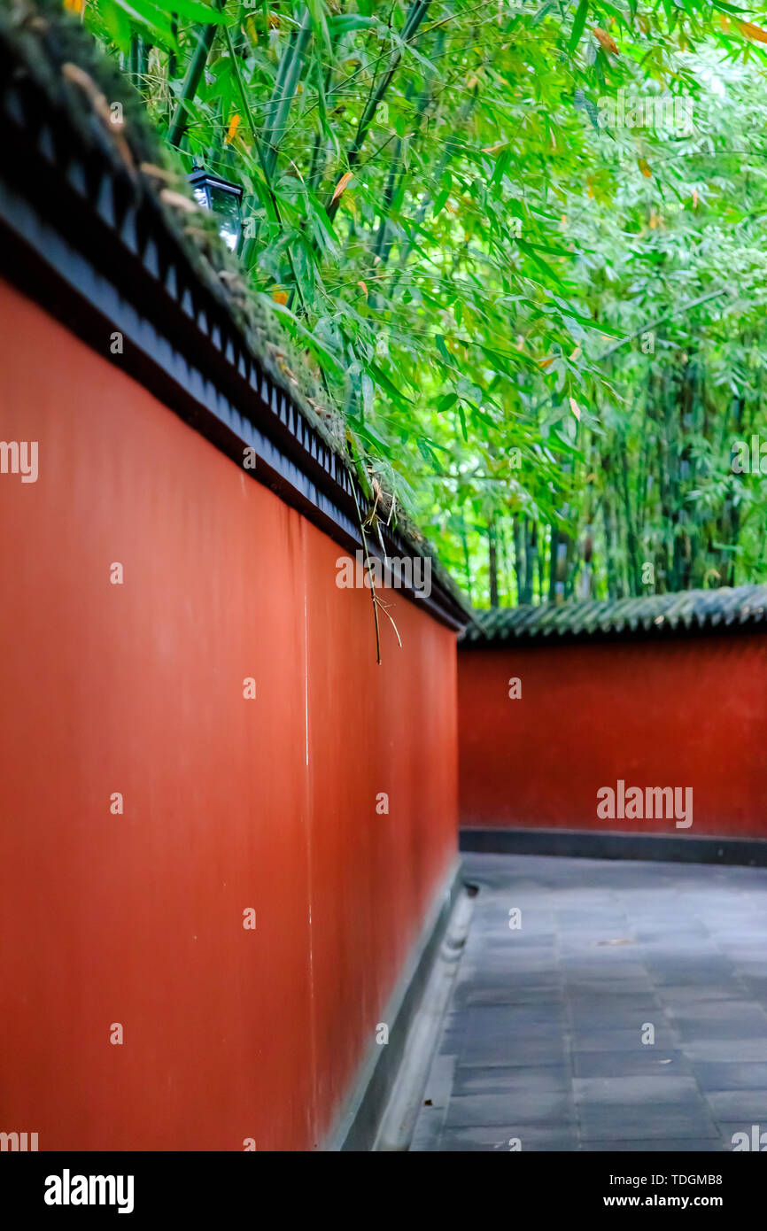 Red palace wall, winding passageway, with emerald bamboo forest Stock ...