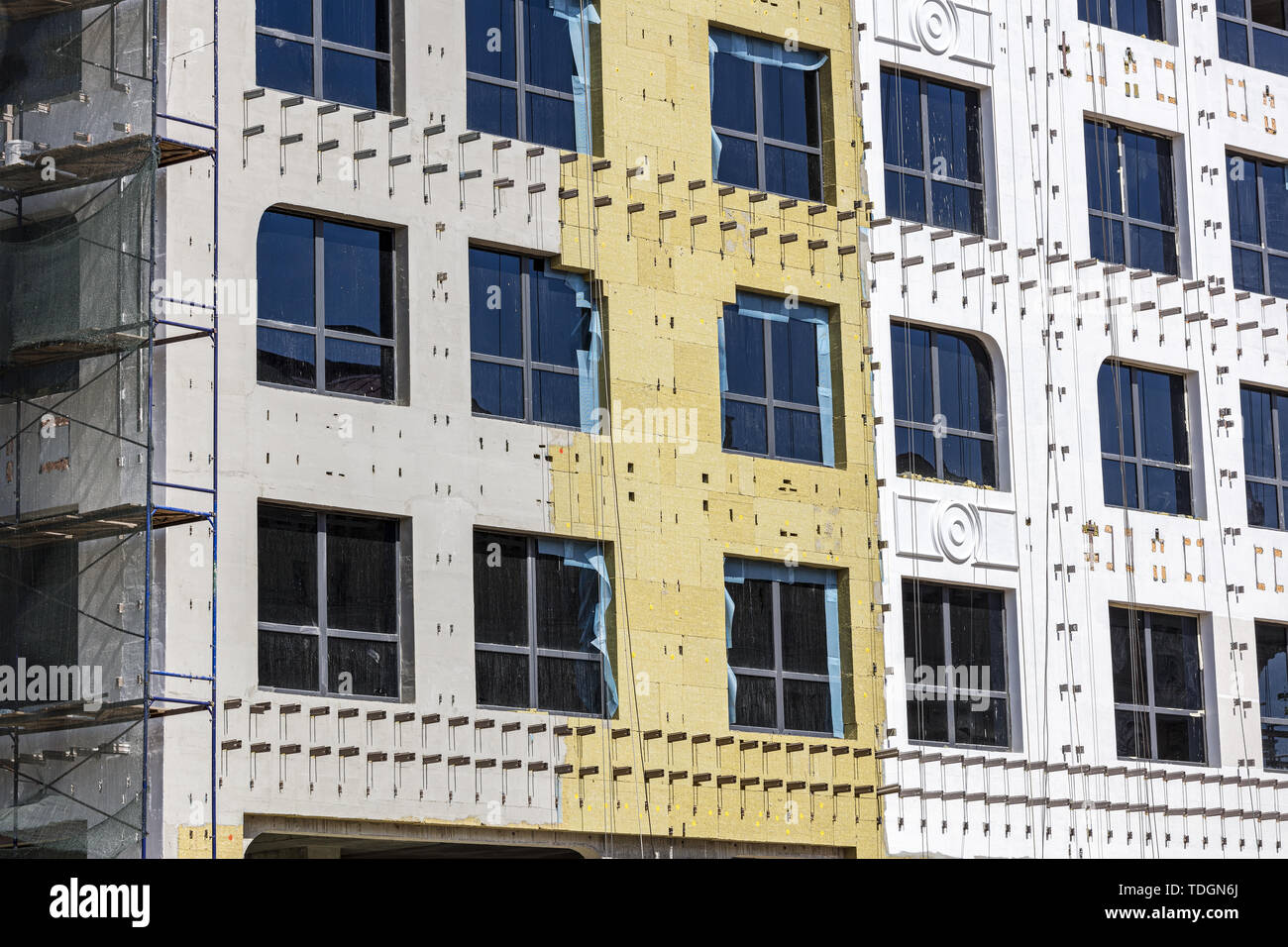 building under construction. thermal protection of building facade ...