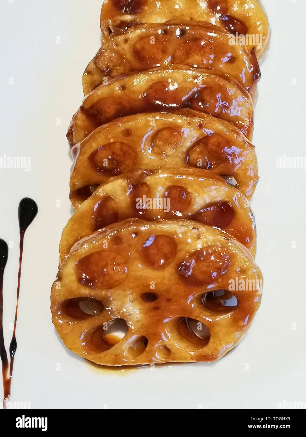 Delicious cuisine - sugar lotus root Stock Photo - Alamy