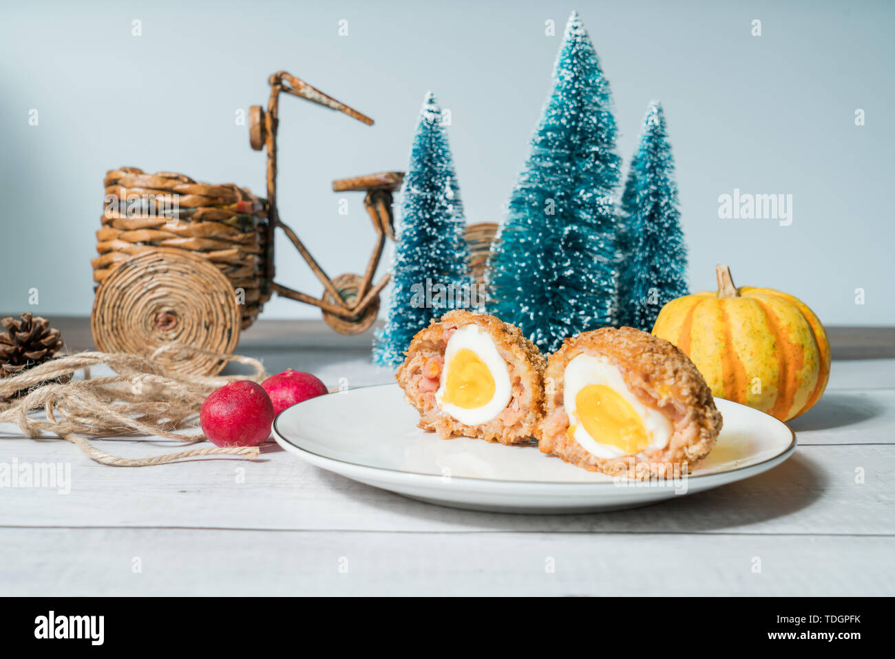 Scottish egg pendulum plate with white background Stock Photo - Alamy