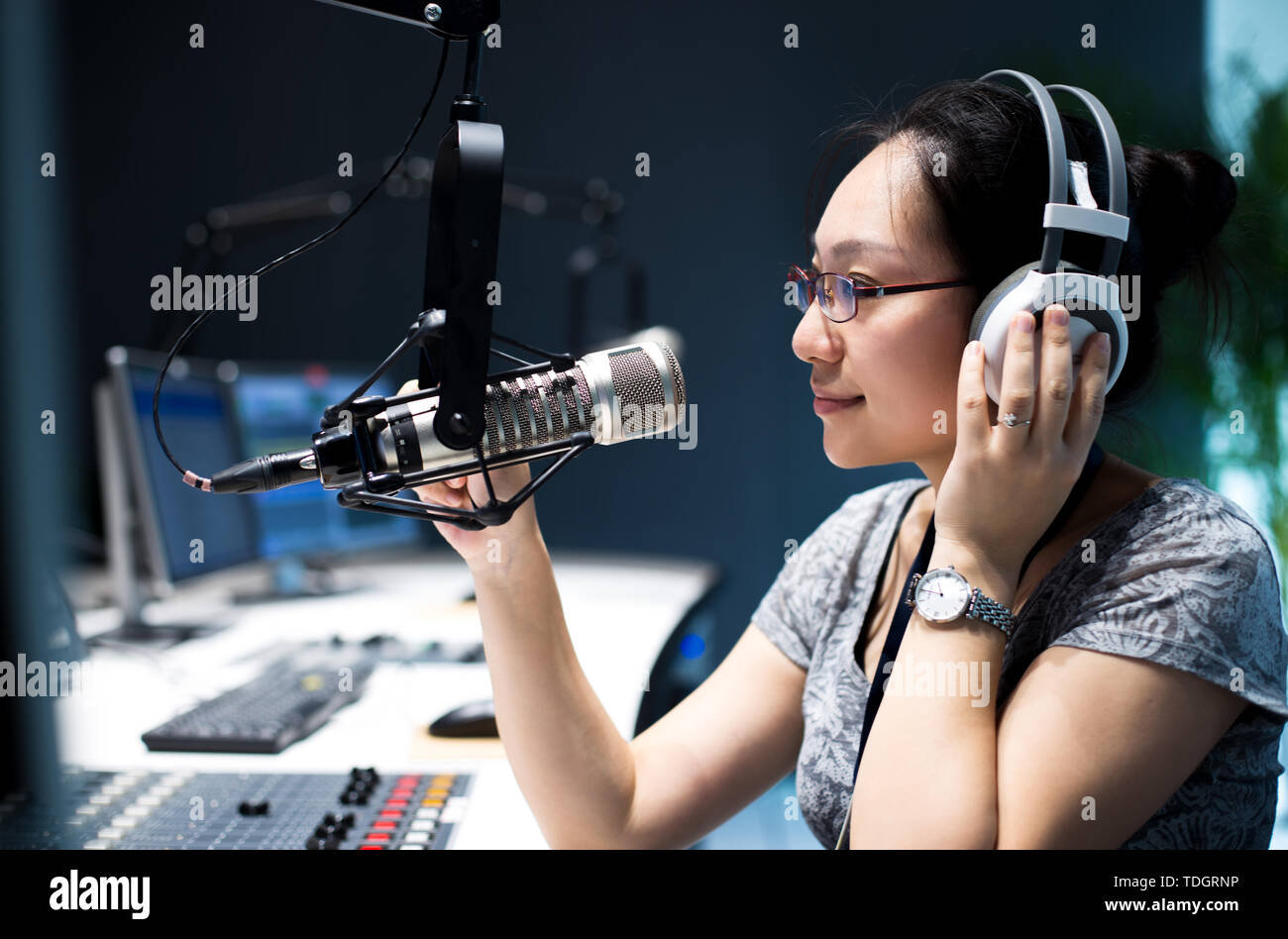 young woman dj works in modern broadcast studio Stock Photo - Alamy