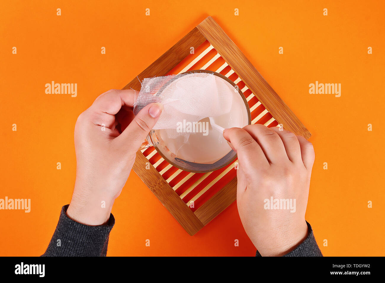3 Diy Halloween ghost of starch and gauze on orange background. Gift ...