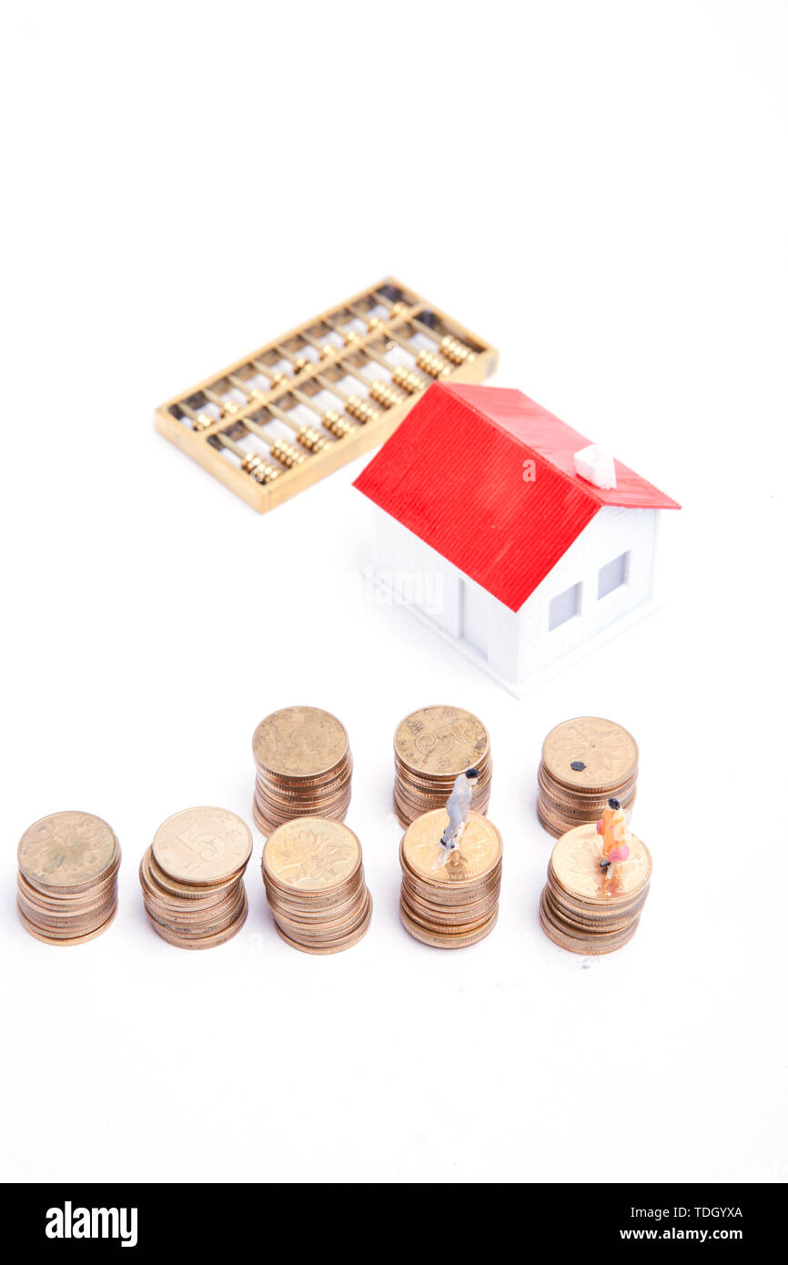 Coin house model and couple on white background Stock Photo - Alamy