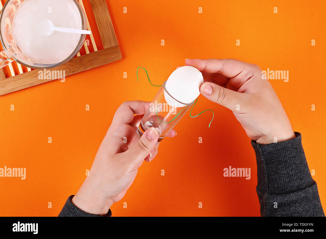 5 Diy Halloween ghost of starch and gauze on orange background. Gift ...