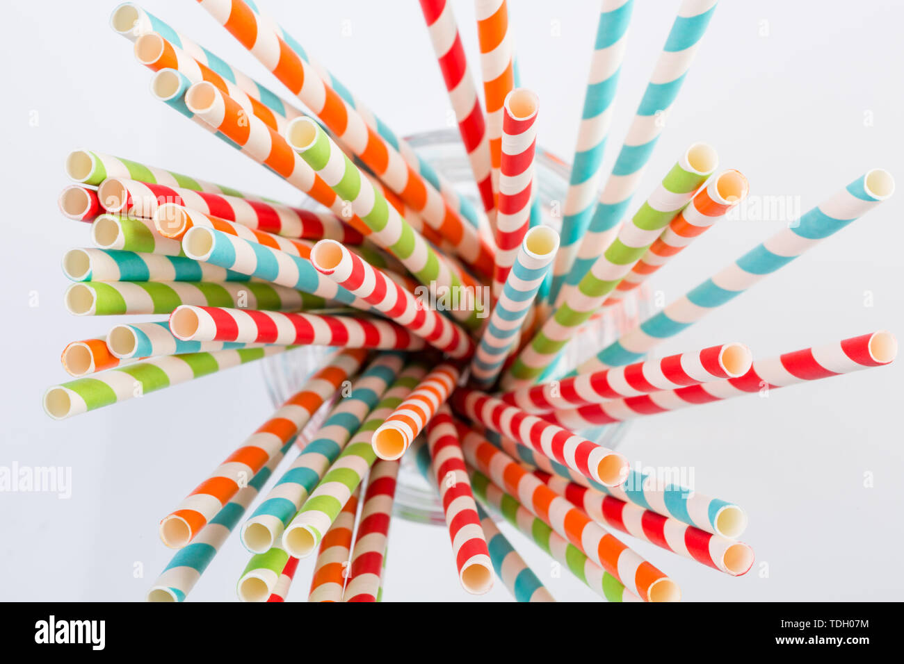 A brightly colored paper straw Stock Photo - Alamy