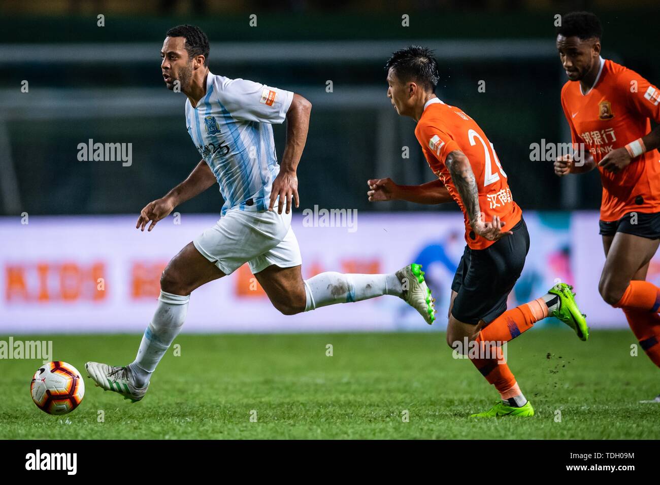 Israeli-Arab football player Dia Saba, left, of Guangzhou R&F passes ...