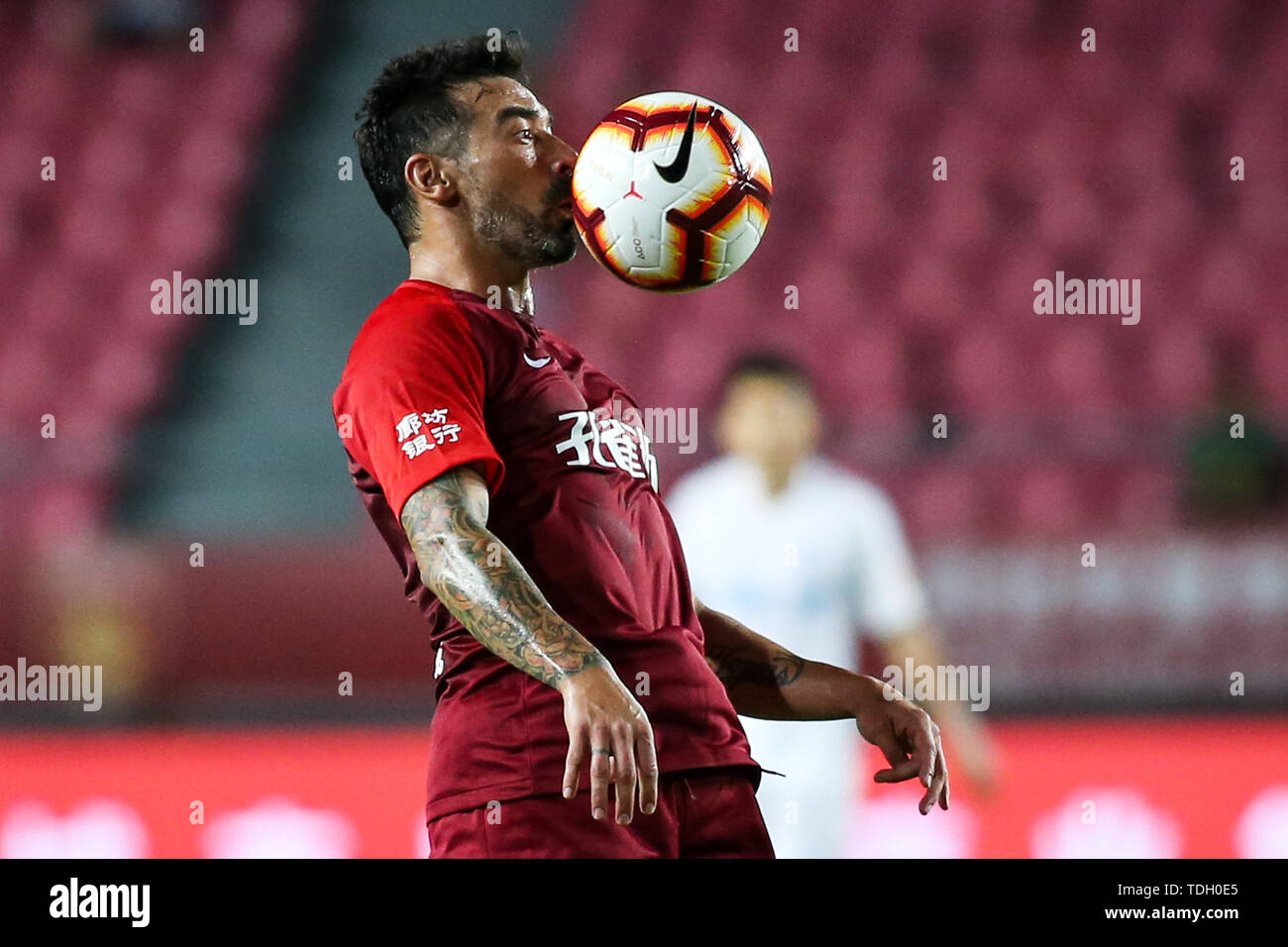 Argentine football player Ezequiel Lavezzi of Hebei China Fortune heads ...