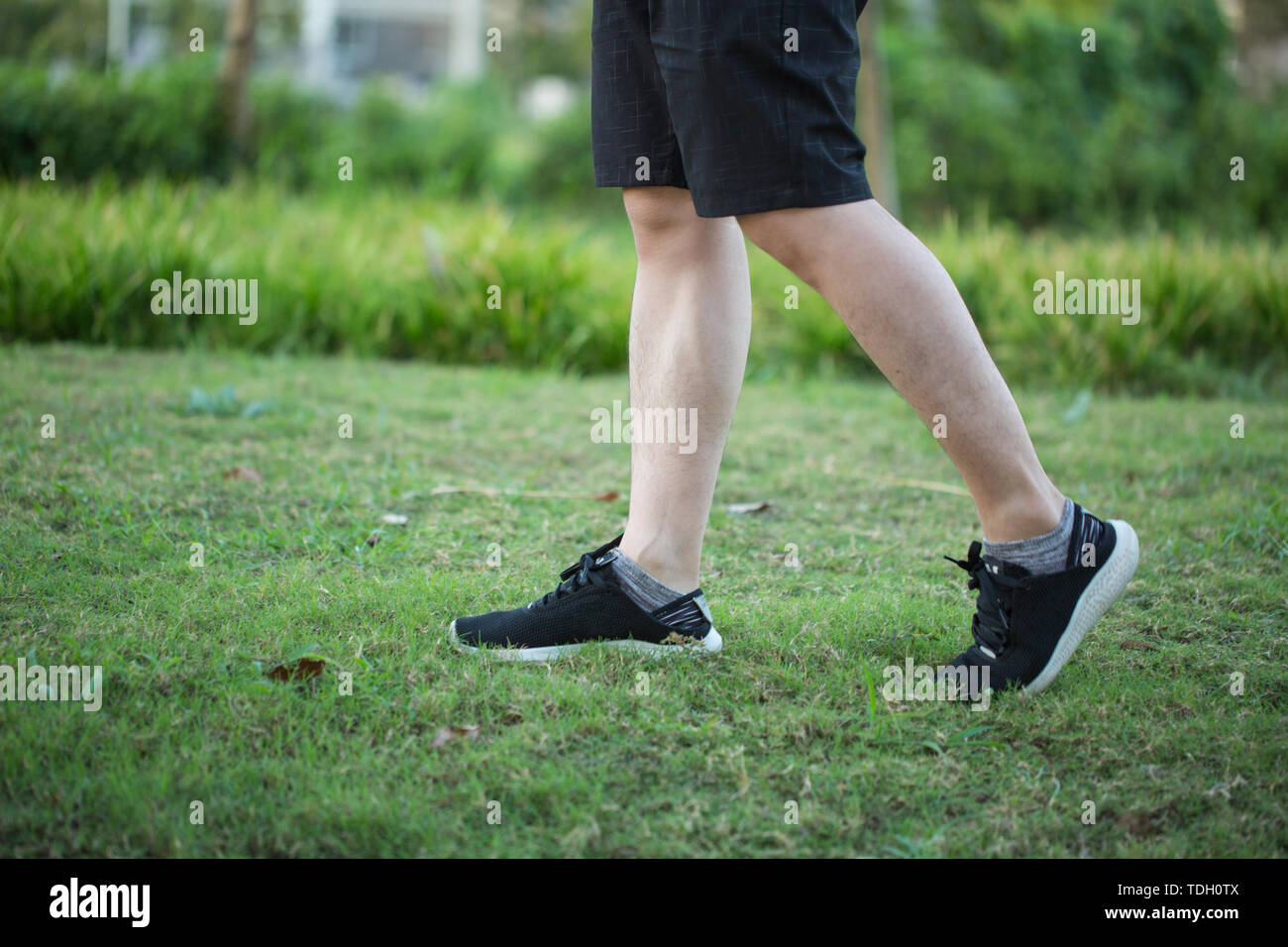 Man running on grass Stock Photo - Alamy