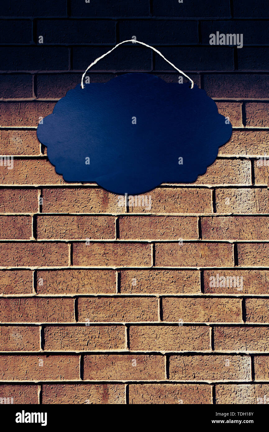 Black Empty Sign Board with string for hanging on wall Stock Photo - Alamy