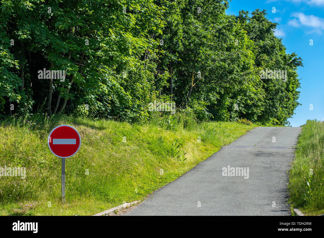 Road sign do not enter. There is no entry to that side. The road goes ...