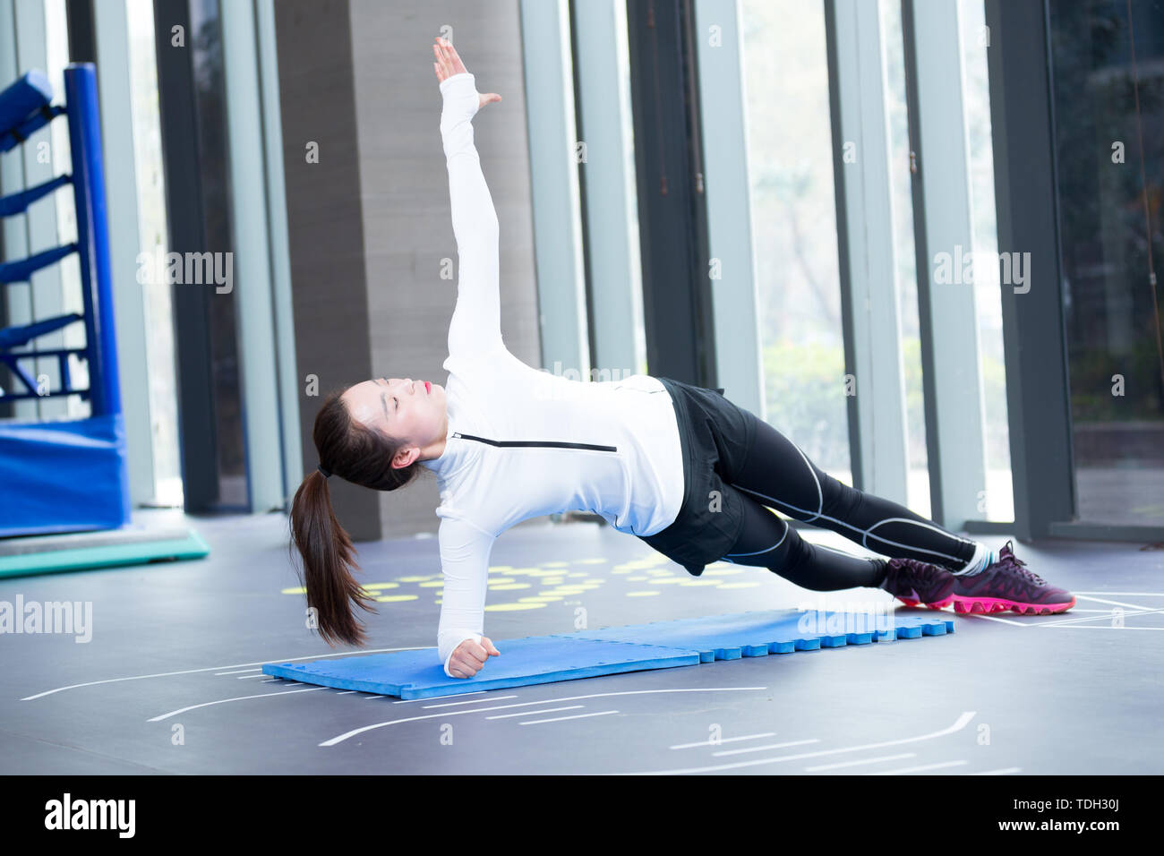 Chinese girl doing yoga hi-res stock photography and images - Alamy