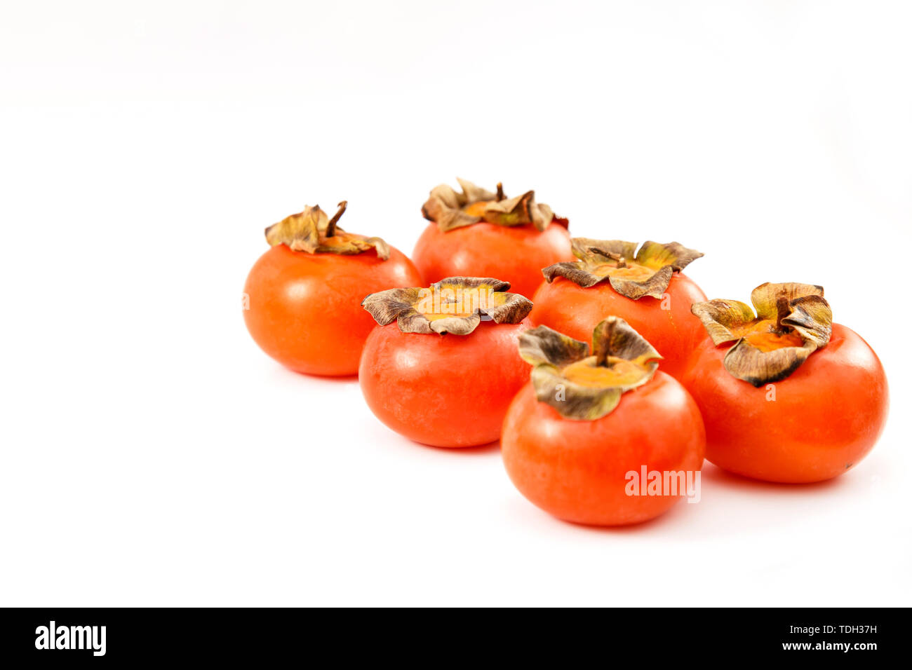 Photographed persimmon in white background Stock Photo - Alamy